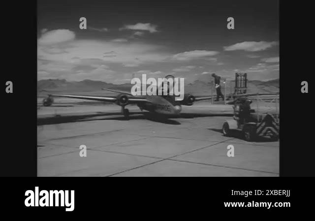 1957 - Ground crews at a Nevada Air Force Base collect radiation ...