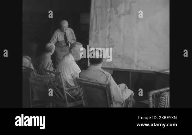 1944 - President Roosevelt and army generals look at a map of Japan and ...
