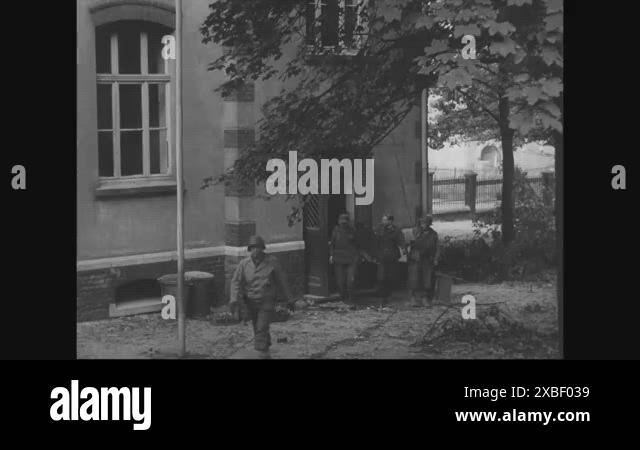 1944 - Wounded and fallen soldiers are carried on stretchers through ...