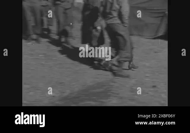 Officers look at a map with Assistant Secretary of Defense Anna ...