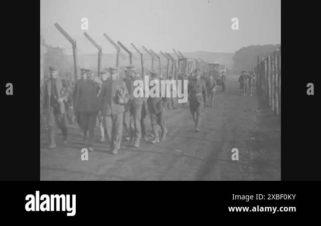 1918 - German prisoners of war carry their equipment to be deloused ...
