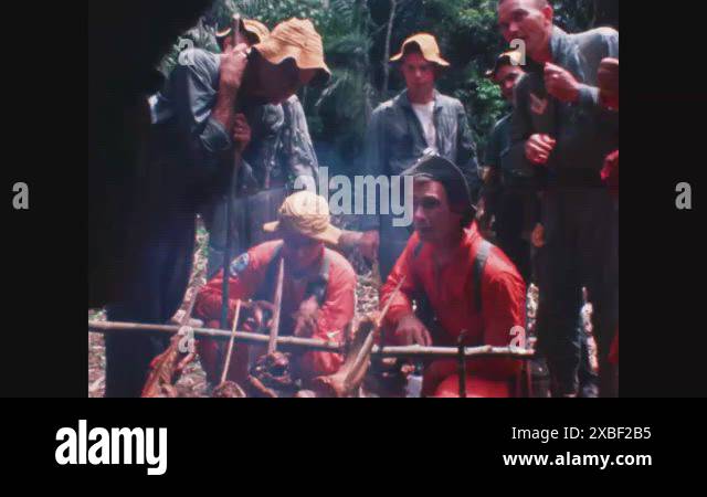 1964 - NASA astronauts cook over a fire, and an indigenous Panamanian ...