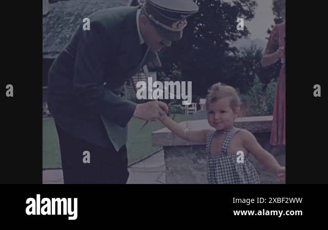 1940s - Adolf Hitler plays with children on the terrace of The Berghof ...