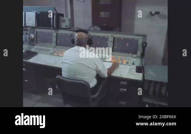 1970, man operates communication switchboard at Mission Control Center ...
