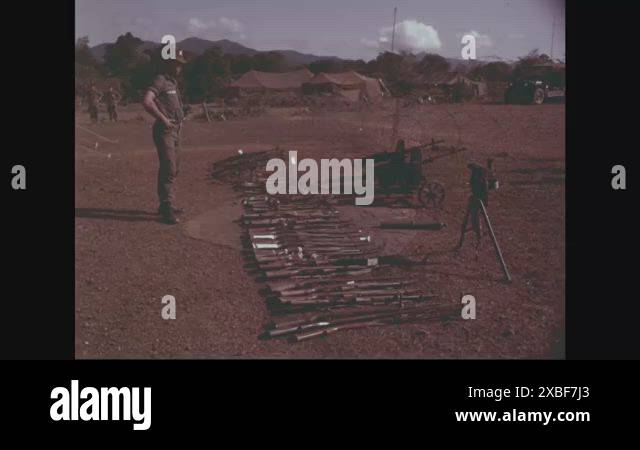 1966, display of captured Viet Cong weapons including automatic rifles ...