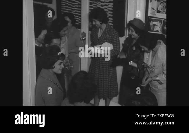 1960 - Akihito and Princess Michiko see a floral display in Iran Stock ...