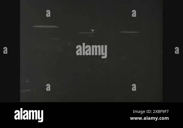 1943 - In the cutting room for Army-Navy Screen Magazine, a sailor and ...