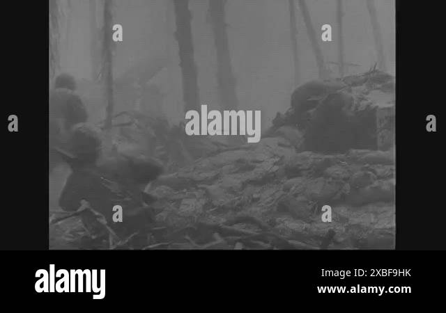 1943 - US Marines traverse a smoky battle area in Tarawa, near the ...