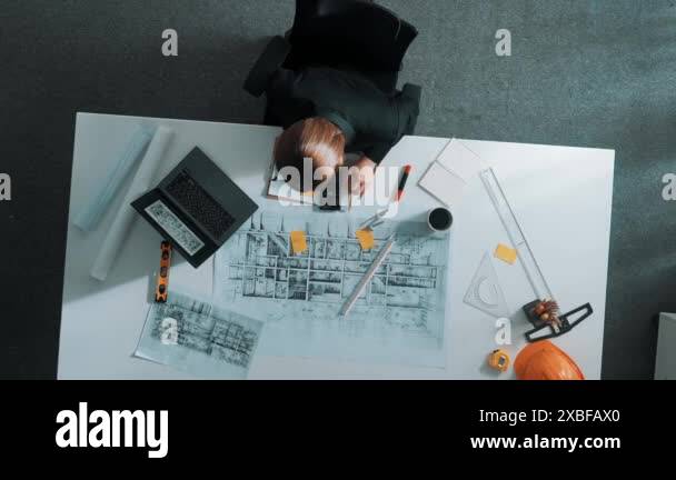 Top view of civil engineer using ruler and equipment to measure ...