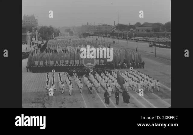 1955 - Crowds cheer for Chairman Mao as he looks on at a May Day Parade ...