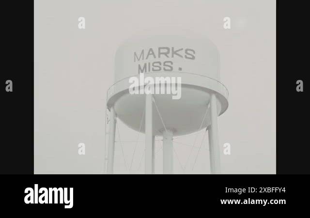 1968 - Water towers and architecture of Marks, Mississippi are shown ...