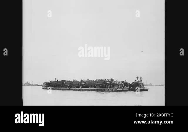 Rhino ferries are shown as well as a bulldozer and a jeep and truck are ...