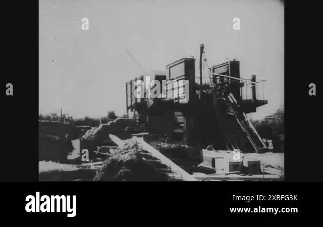 1940s - Nazi soldiers wheel cannons and large guns into place, and fire ...
