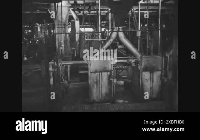 1940s - Defense plant machinery is shown among propaganda posters, and ...