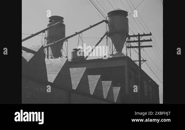 1930s - A steam engine passes through an industrial site in Chicago ...