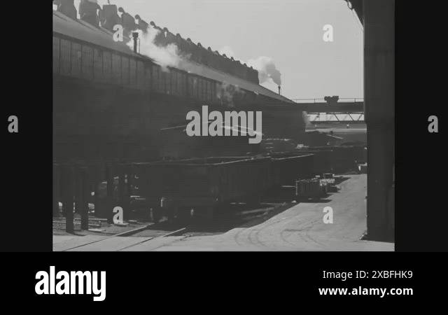 1930s - Workers drive materials through a Chicago factory, while steam ...