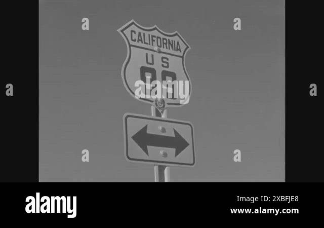 1938 - Road signs for California's US Route 99 are seen, and a train ...