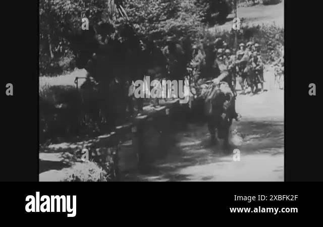 1940 - Combat footage shows German soldiers advancing amidst machine ...
