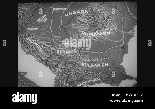 1940s - German soldiers cross a mountainside river on a raft, and float ...