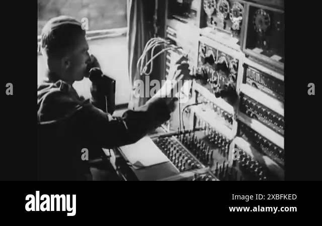 1939 - Hitler, Goering, and other Nazi officers look over a map in an ...