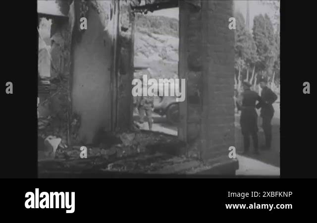 1942 - German Army engineers repair a bridge. Others drive an ...