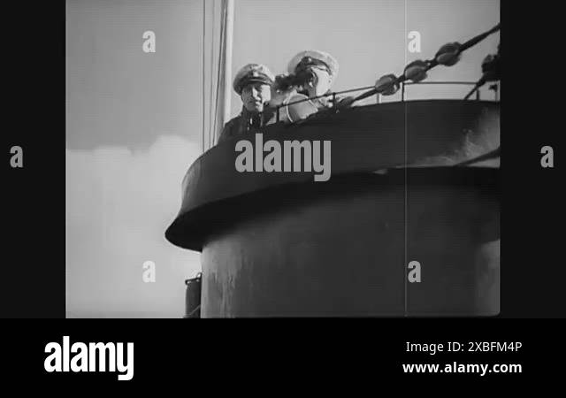 1940s - The crew of a German submarine goes below deck so the craft can ...