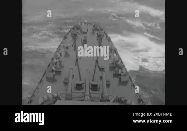 1945 - Bow and aft views show the USS Indiana moving through choppy ...