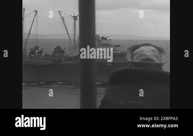 1940s - Officers of the US Army and Navy talk to each other on the deck ...