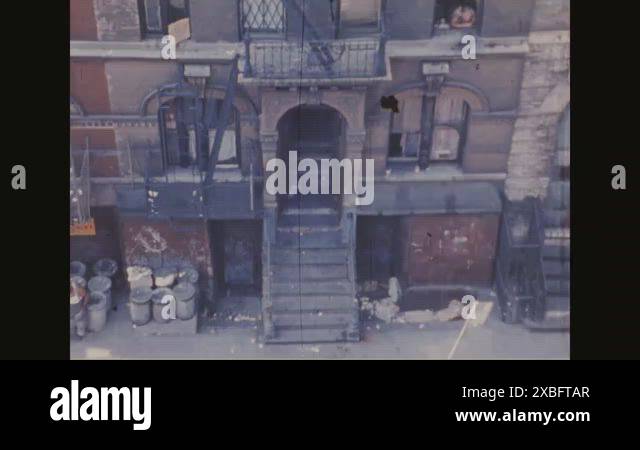 Workers begin to renovate an old and rundown New York City apartment ...