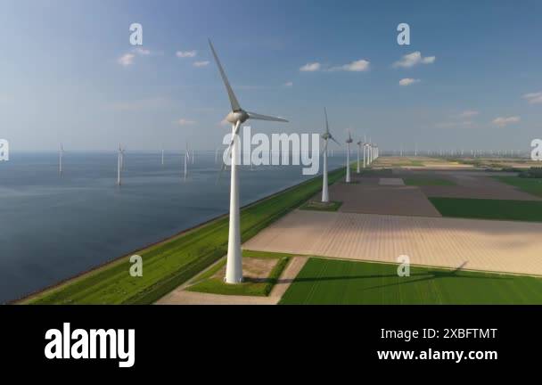 windmill park with clouds and a blue sky, windmill turbines generate ...