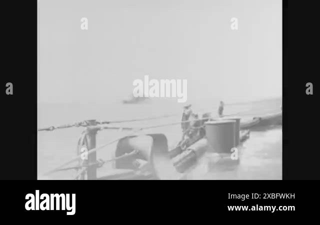 American soldiers prepare and load shells for the USS New Mexico's big ...