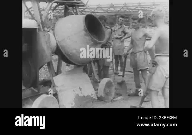 Prisoners in a World War II Japanese prison camp perform hard labor ...