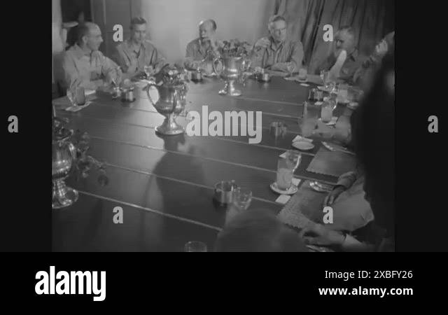 1945 - Officers eat dinner and Fleet Admiral Halsey cuts his cake ...