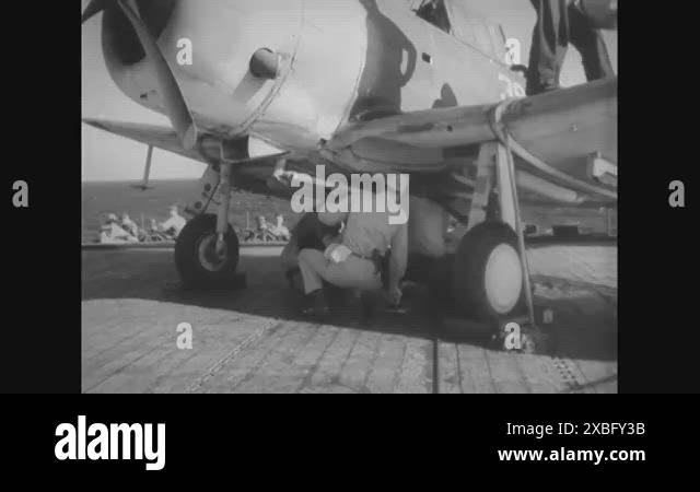1941 - Crew members load airplanes with bombs before the Wake Island ...