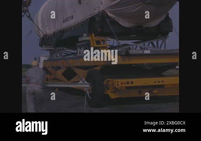 1965 - A Gemini launch vehicle is hooked up to a hoist at the Kennedy ...