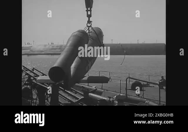 1948 Us Navy Sailors Hoist A Guided Missile Onto Their Vessel And Assemble Various Parts Of It