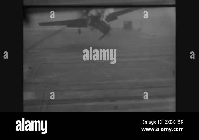 1950 - A US Navy plane bursts into flames when it makes a bump landing ...