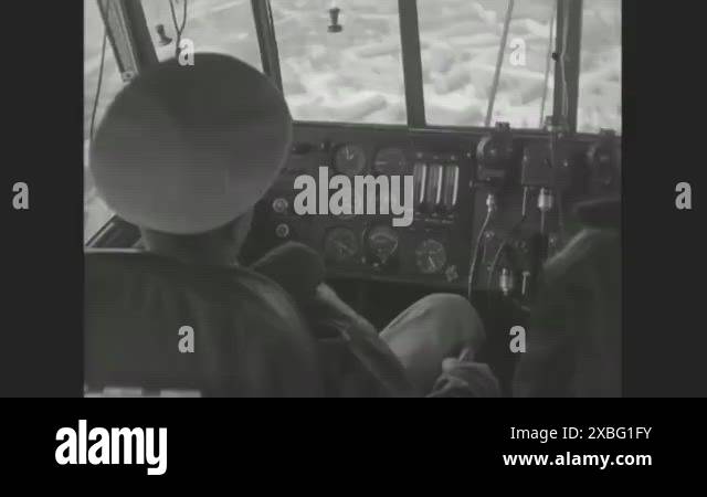 1945 - A US Navy pilot and co-pilot are shown flying a blimp Stock ...