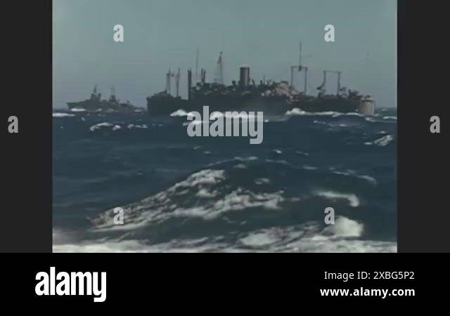 1943 - A transport ship and cruiser on way to Kiska Island from Adak ...