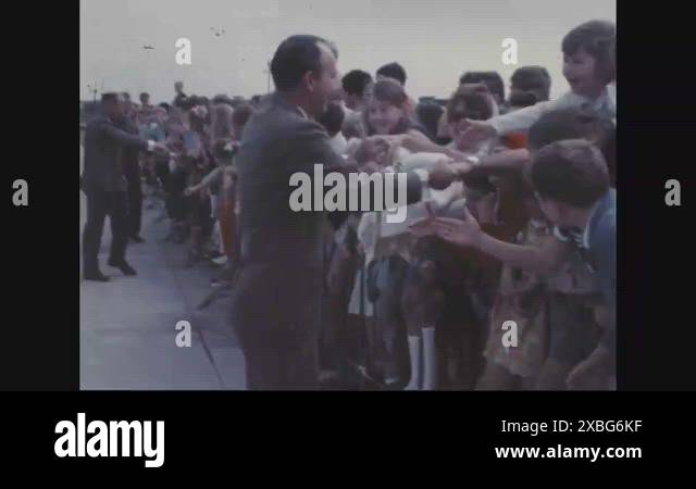 1971 - The Apollo 11 astronauts shake hands and sign autographs with an ...