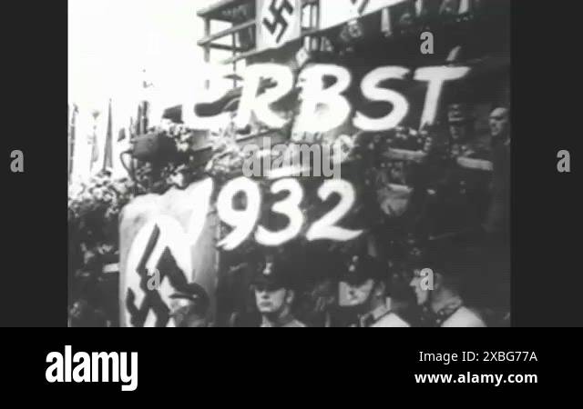 1932 - Hitler gives a speech, intercut with newspaper headlines about the state of affairs in ...