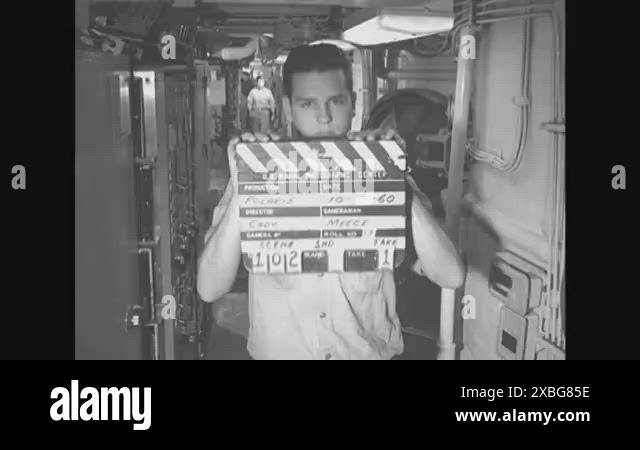 1960 - US Navy seamen man their positions on the center level missile ...