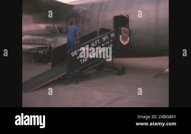 An ambulance bus is shown as well as doctors boarding a military ...