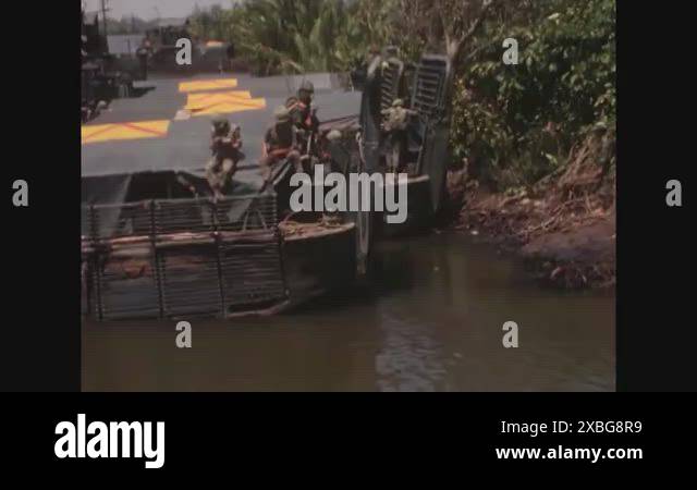 South Vietnamese soldiers and United States Marines look at a map and ...