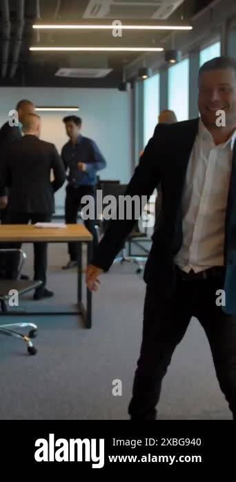 Couple in business office dancing after winning deal celebrating. Two ...