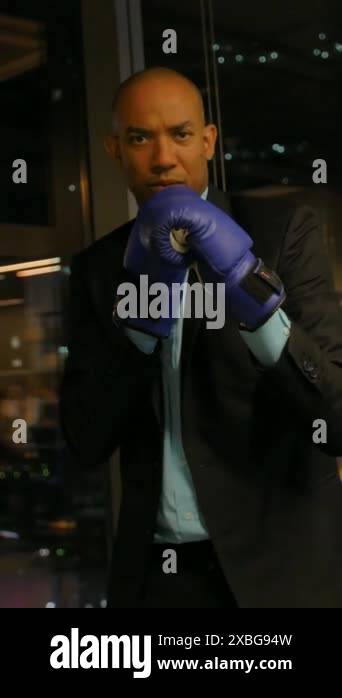 Portrait of Young african american boxer in office formal suit posing ...