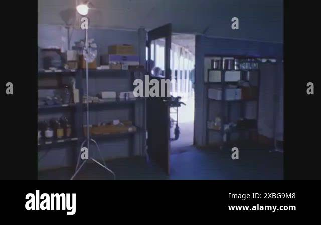 A wounded soldier is wheeled in on a gurney and his uniform is cut off ...