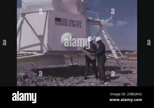 1965 - Two engineers look at blueprints at the NASA Manned Spaceflight ...