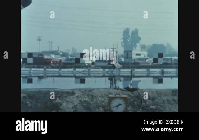 1965 - Shown in slow motion from a side view, an Apollo command module ...