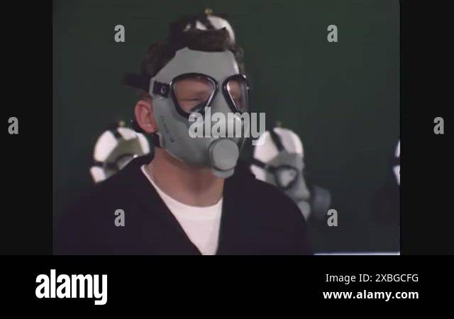 1960 - Close ups on different types of gas masks, and using a gas mask ...